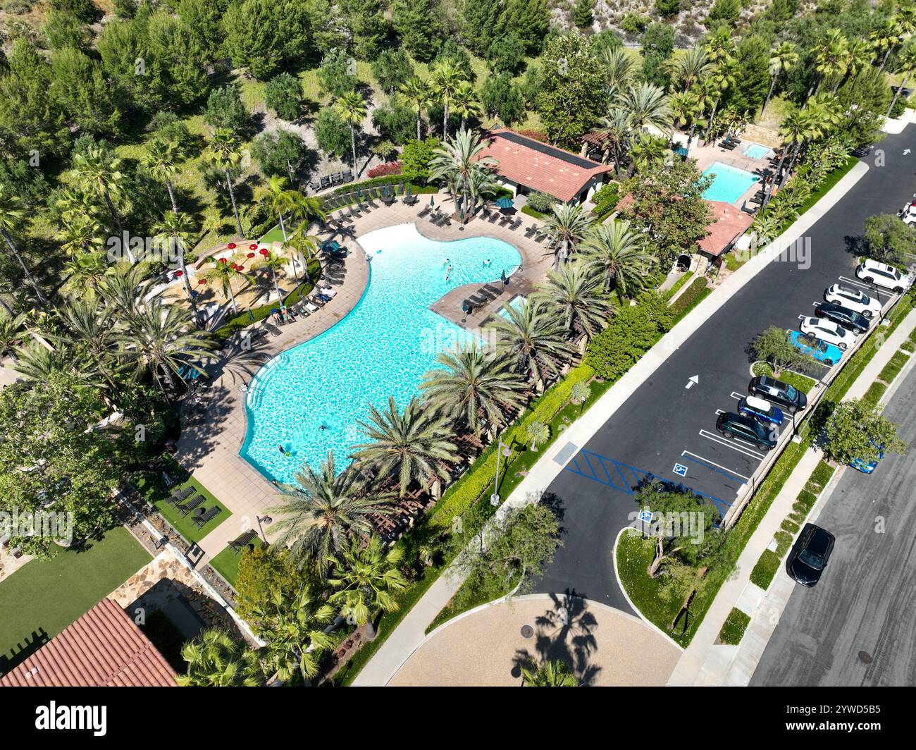 Aerial video of recreational facilities with pool in private ...