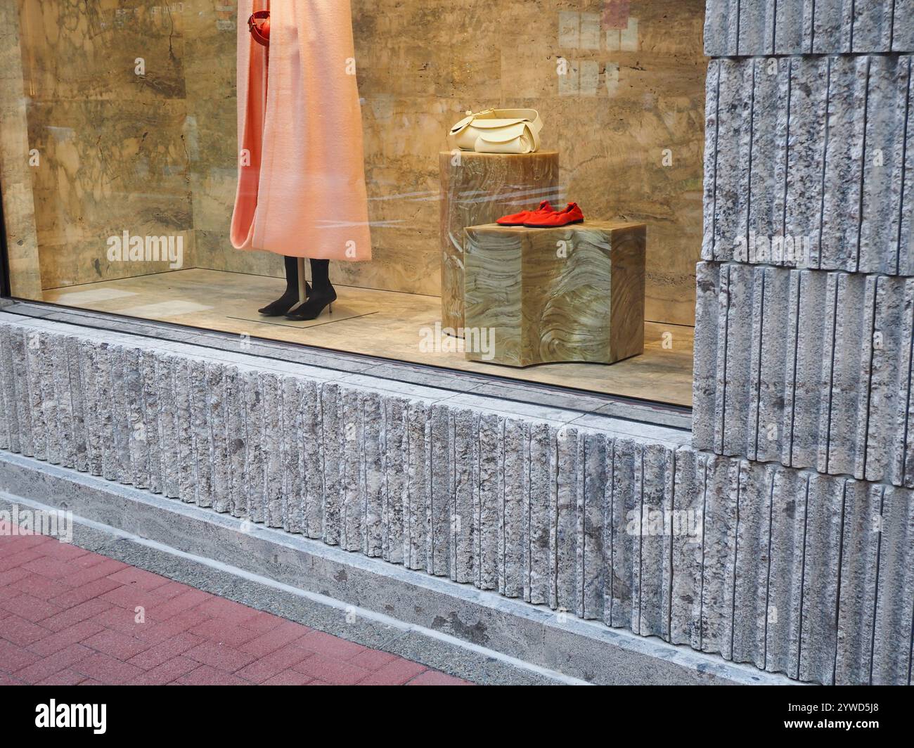 TOKYO, JAPAN - December 3, 2024: Display in a window of a Jil Sander ...