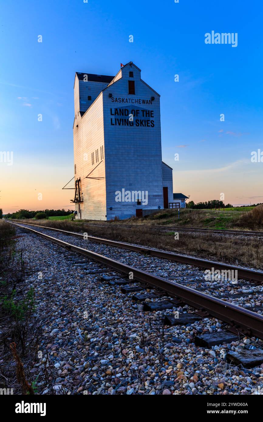 A grain silo with the words "Land of the Living Skies" painted on it ...