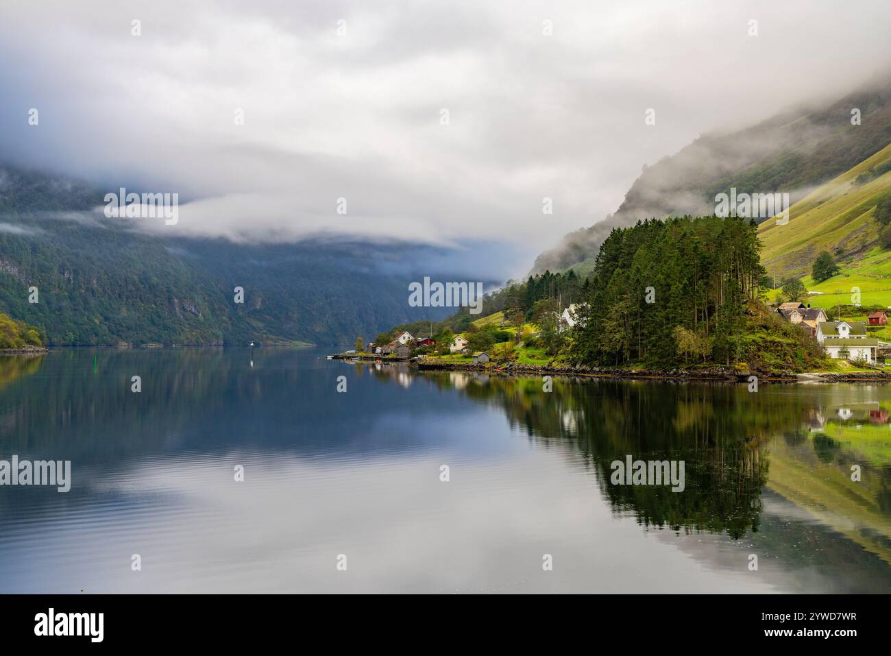 The farming village of Dyrdal with its pretty white church on the shore ...