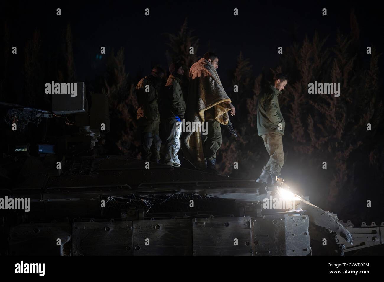 11 December 2024, Israel, Yuval: Israeli soldiers gather as they return ...