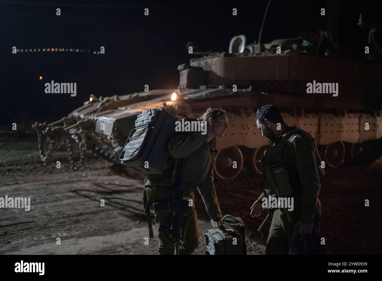 11 December 2024, Israel, Yuval: Israeli soldiers gather as they return ...