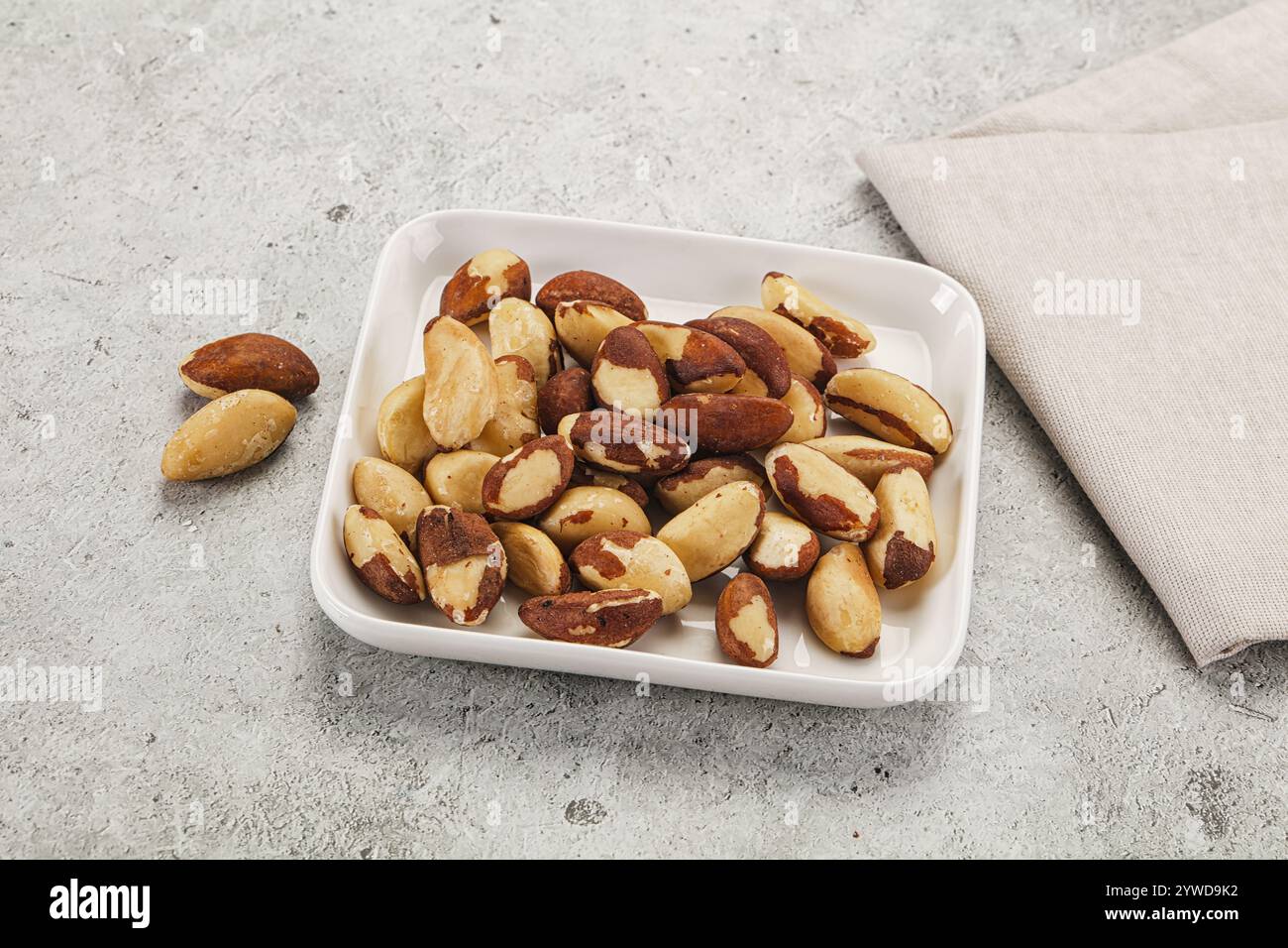 Brazil nut kernel heap in the bowl Stock Photo - Alamy
