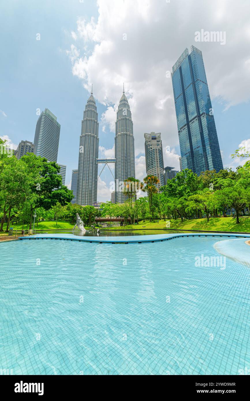 Outdoor swimming pool at the KLCC Park and skyscrapers Stock Photo - Alamy