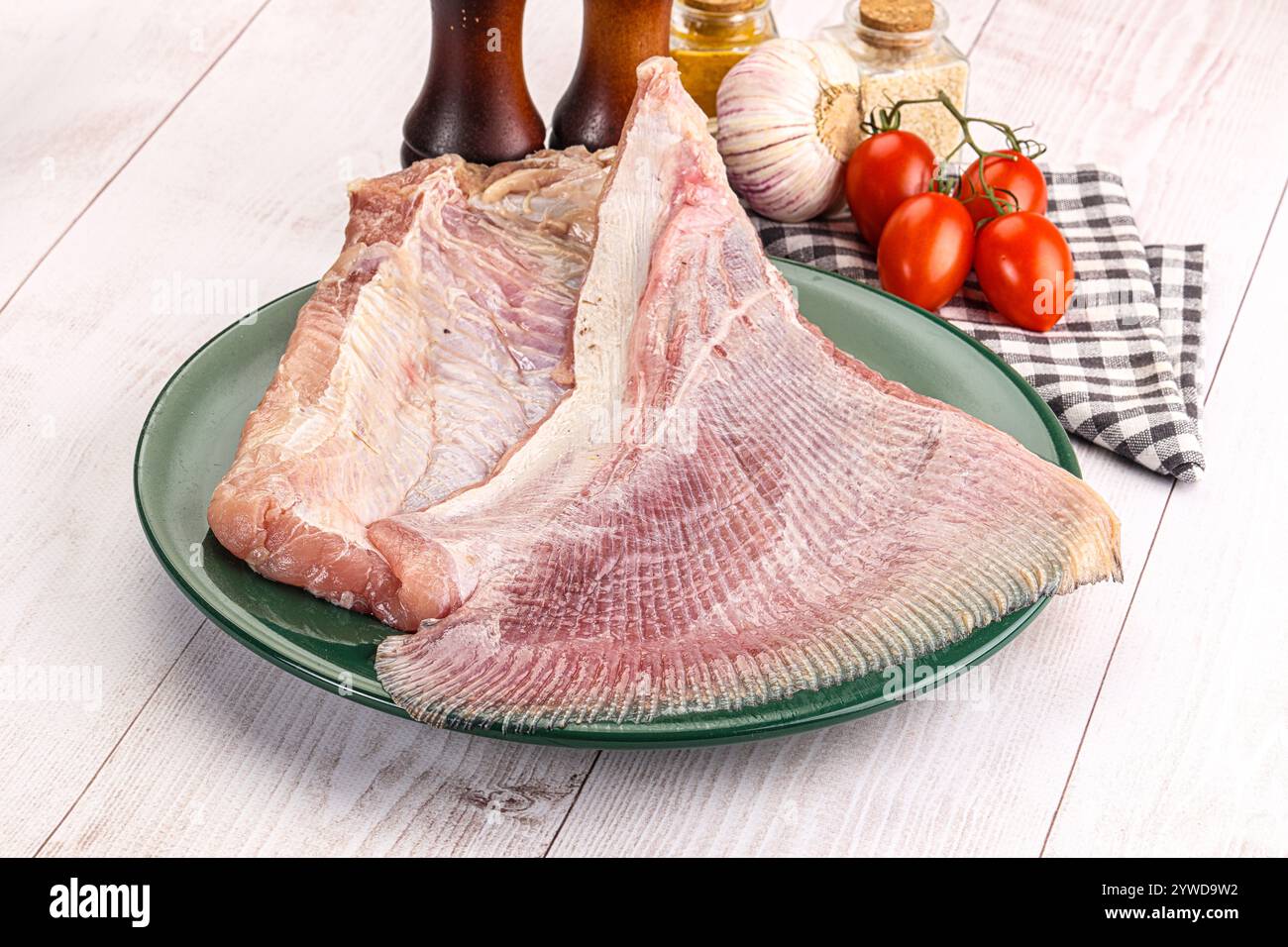 Raw uncooked stingray fish wing in thw plate Stock Photo - Alamy