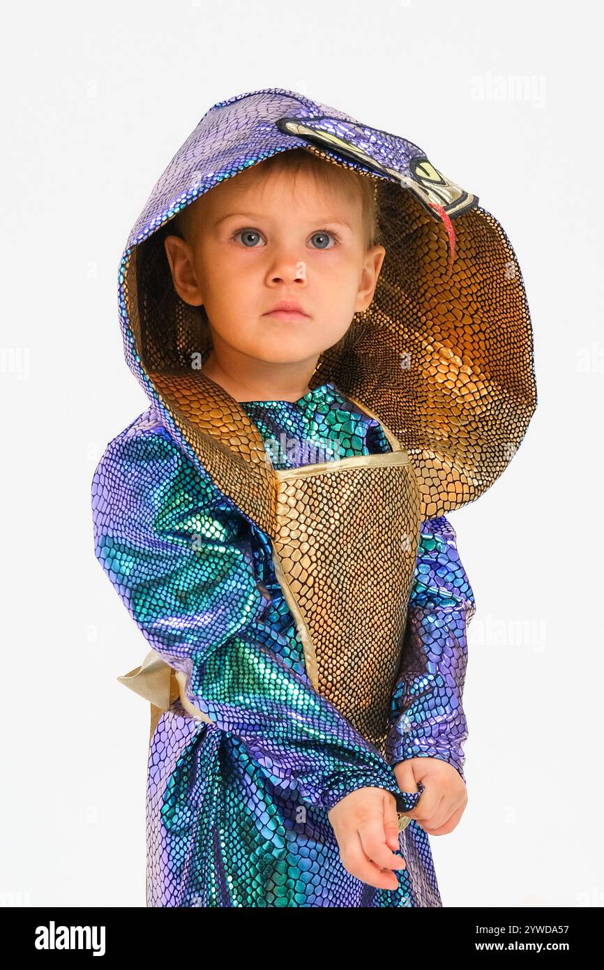 Child in a snake costume in an egg Stock Photo - Alamy