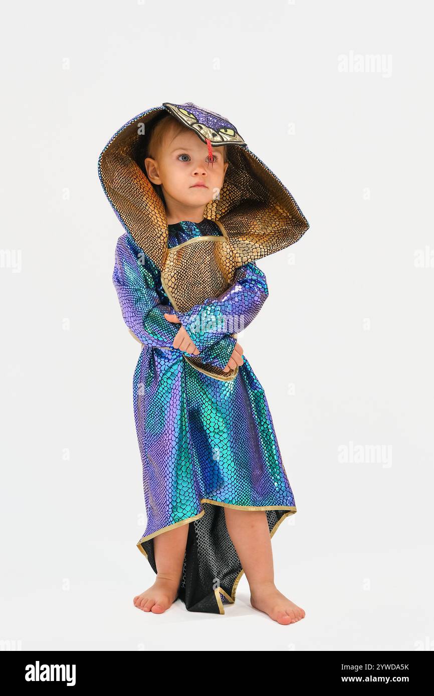 Child in a snake costume in an egg Stock Photo - Alamy
