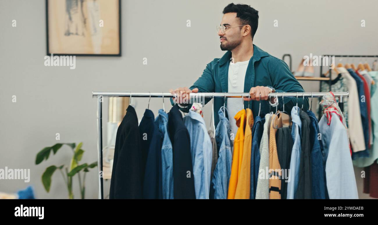 Clothing rack, creative and wardrobe with fashion designer man in ...