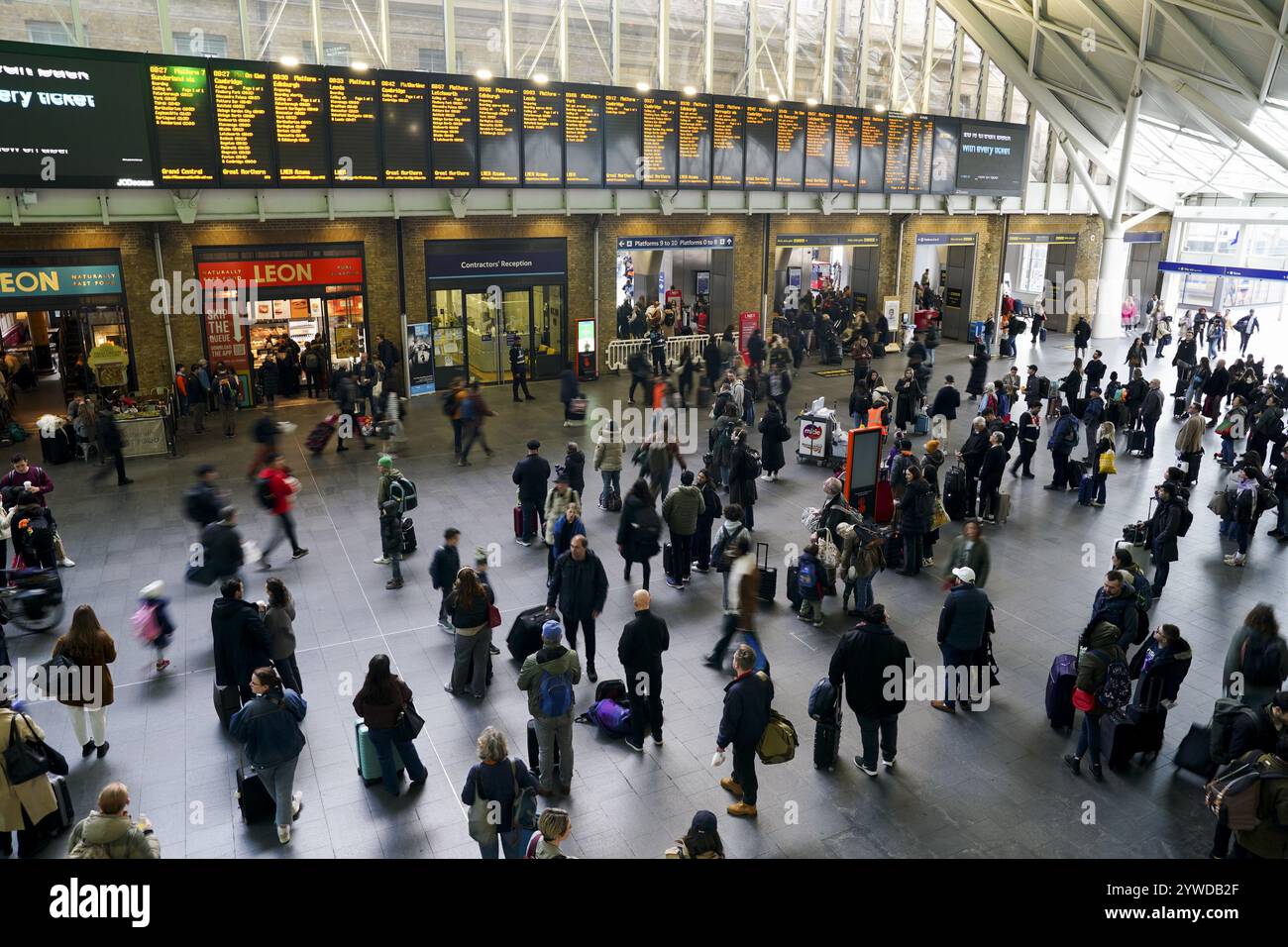 File photo dated 29/03/24 of passengers waiting for trains at London ...