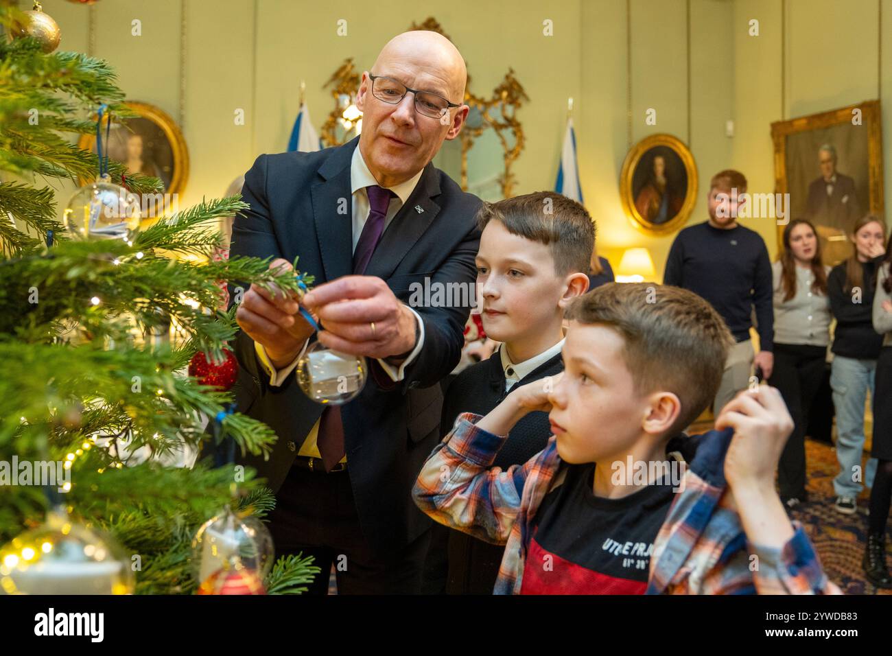 First Minister John Swinney with Kayden Cooper (left), 10, and Jacob ...