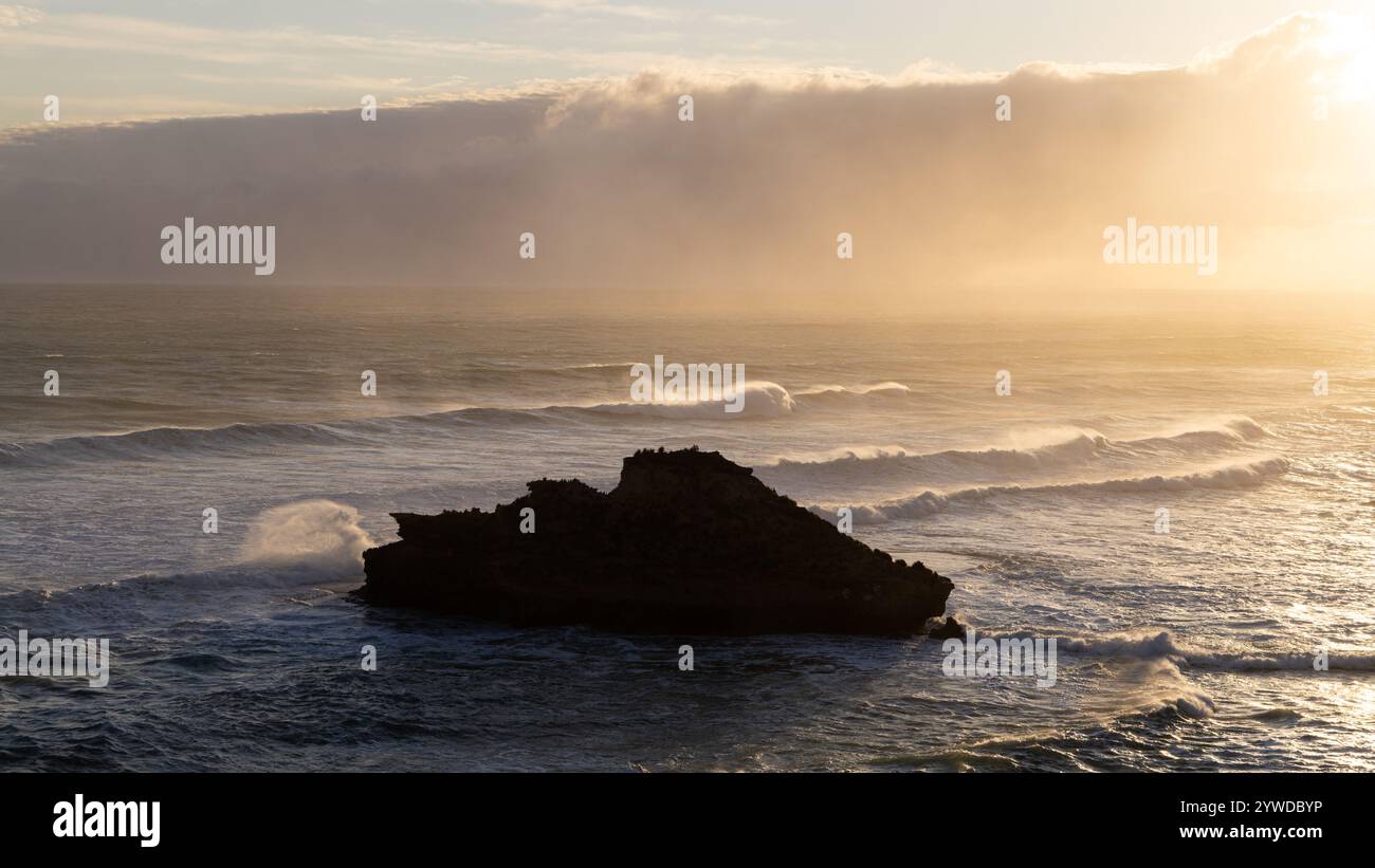 Island looking like a speed boat racing the incoming waves Stock Photo ...