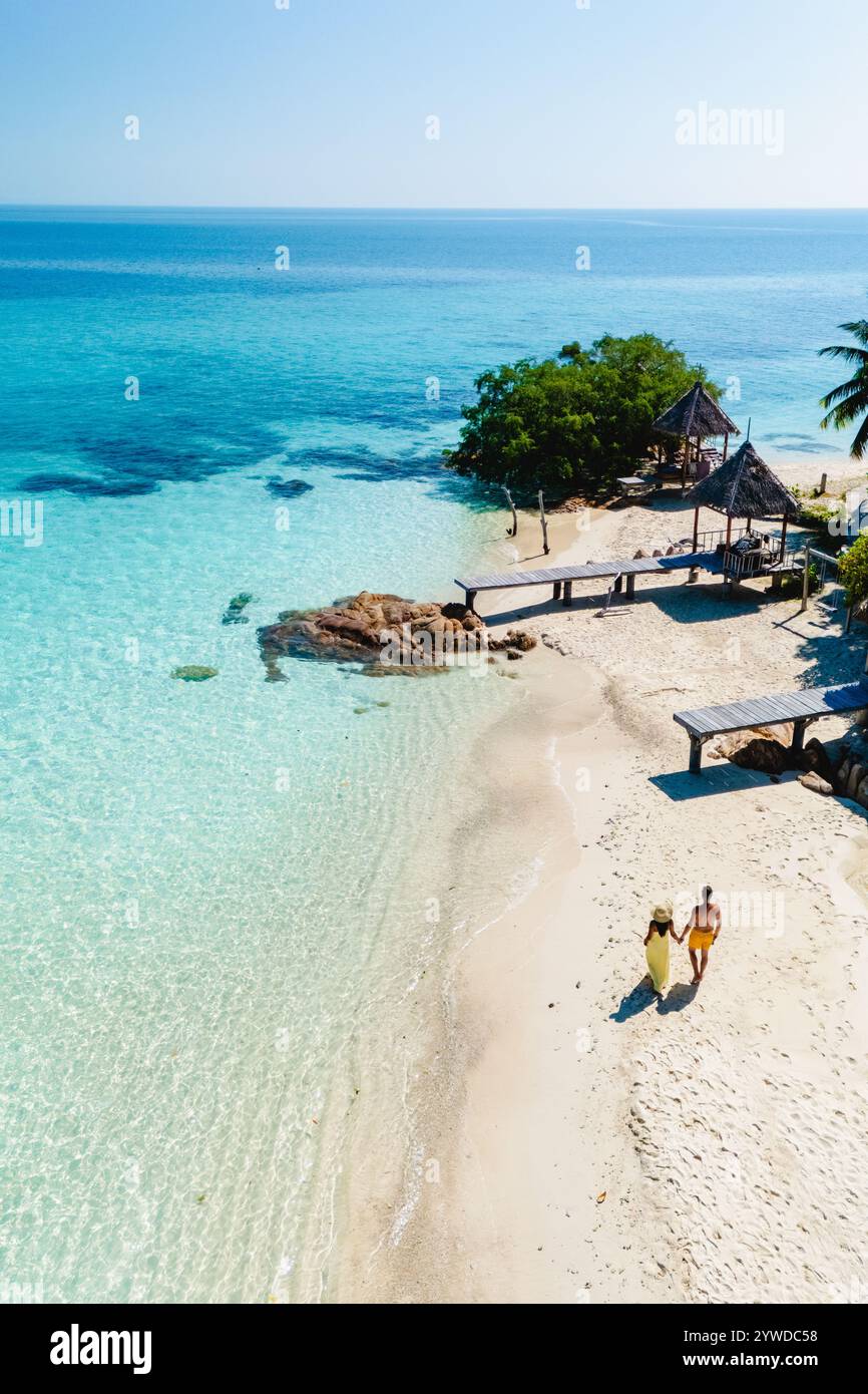 Couples stroll along serene wooden hi-res stock photography and images ...
