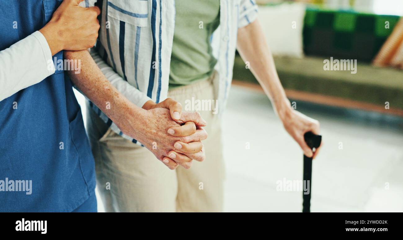 Physiotherapy, holding hands and patient with cane for support ...