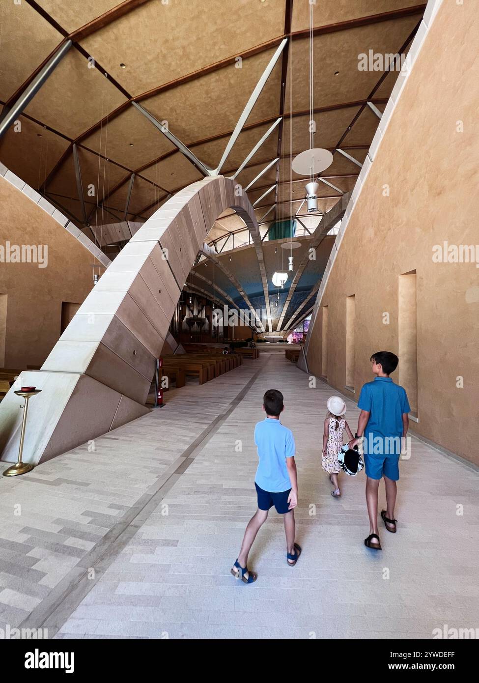 A family walks through a modern church interior with unique ...