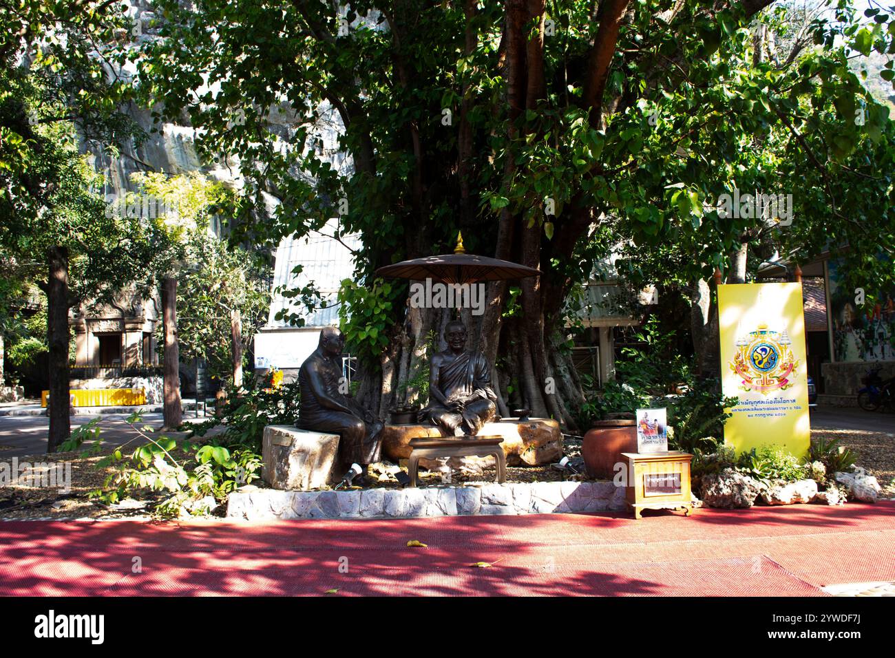 Luang Phor Ruesi Lingdam monk statue under bodhi tree for thai people ...