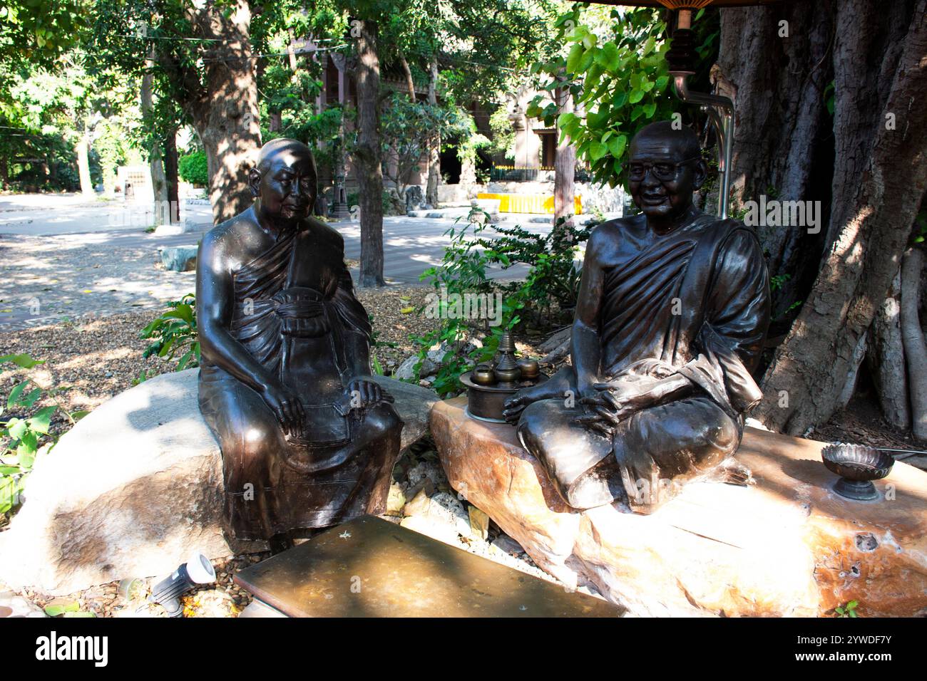 Luang Phor Ruesi Lingdam and monk statues under bodhi tree for thai ...