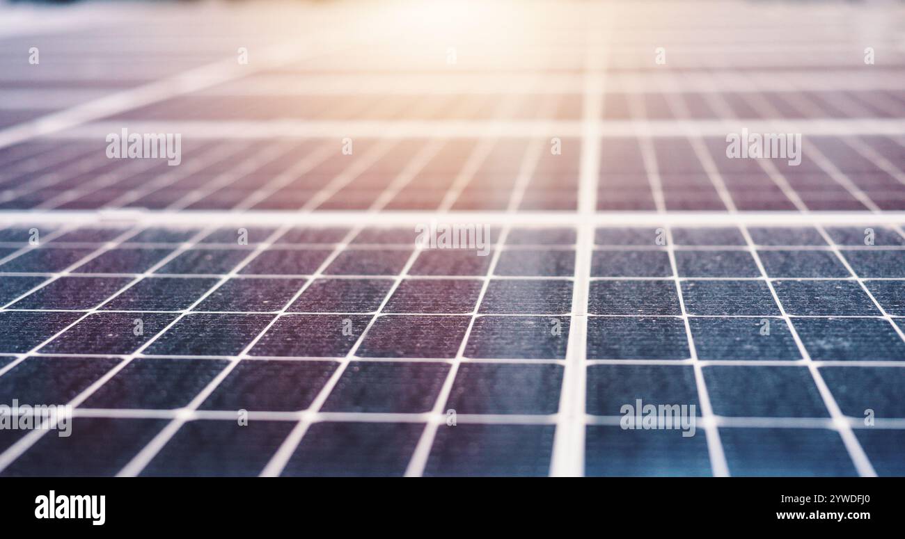 Closeup, lens flare and solar panel with sustainable electricity, eco ...