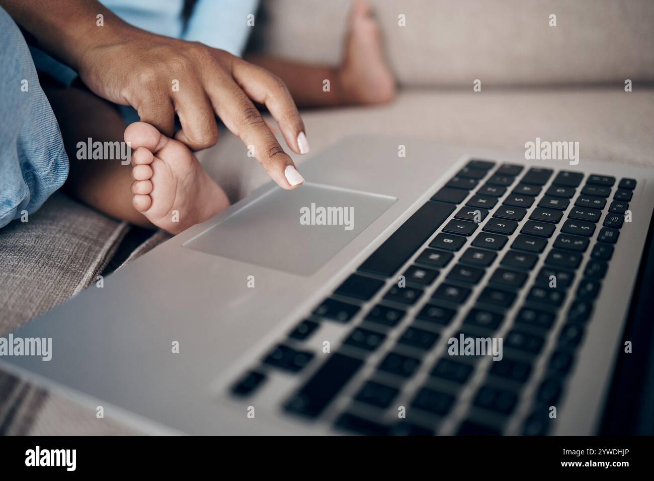 Woman, hands and baby with laptop in home, typing and online search for ...