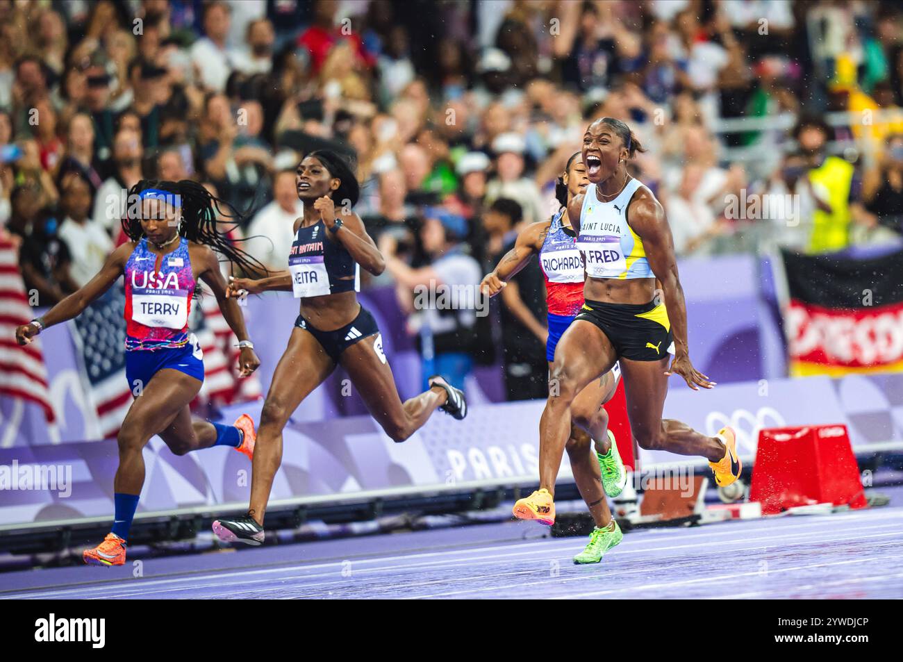 Julien Alfred winning in the 100 meters relay at the Paris 2024 Olympic ...