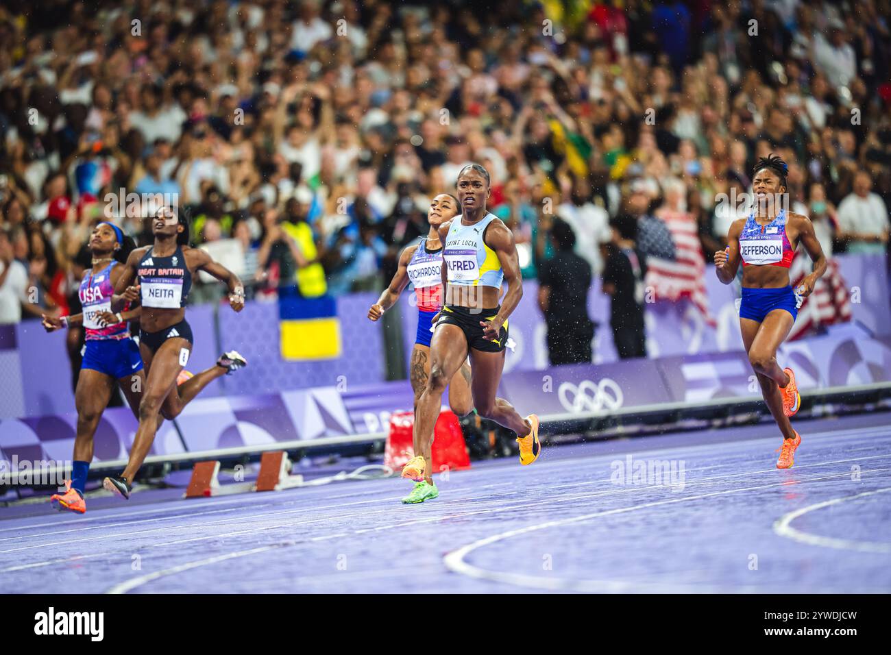 Julien Alfred winning in the 100 meters relay at the Paris 2024 Olympic ...