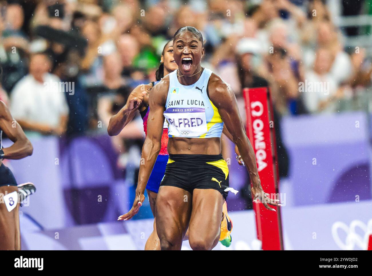 Julien Alfred winning in the 100 meters relay at the Paris 2024 Olympic ...