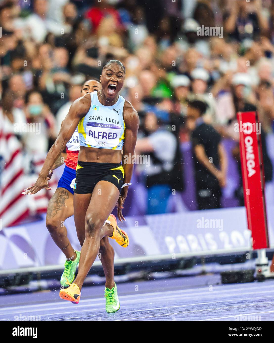 Julien Alfred winning in the 100 meters relay at the Paris 2024 Olympic ...