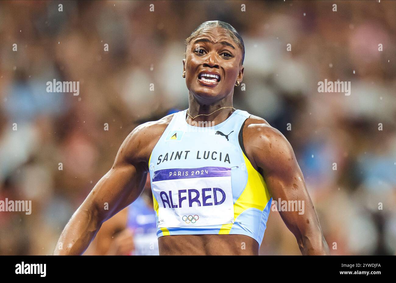 Julien Alfred winning in the 100 meters relay at the Paris 2024 Olympic ...