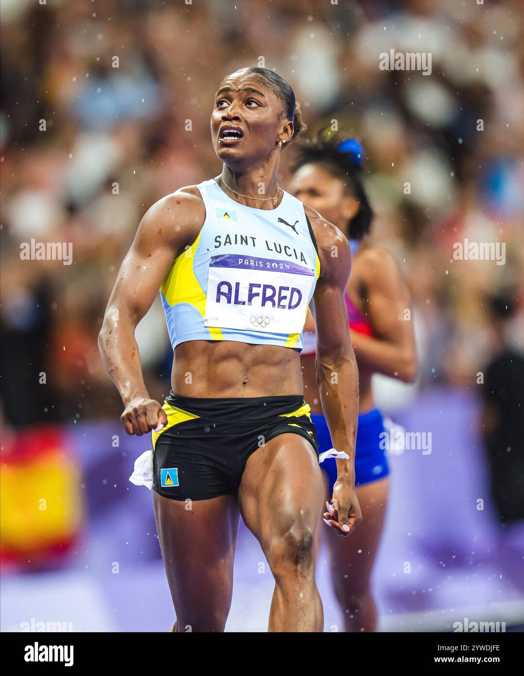 Julien Alfred winning in the 100 meters relay at the Paris 2024 Olympic ...