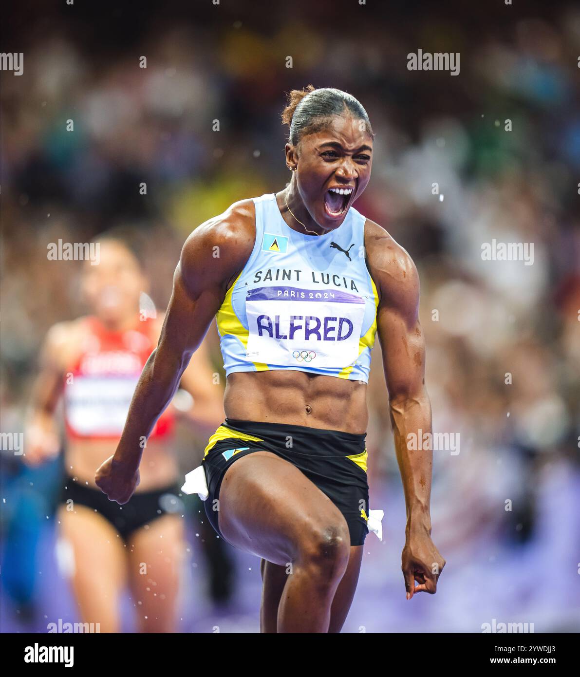 Julien Alfred winning in the 100 meters relay at the Paris 2024 Olympic ...