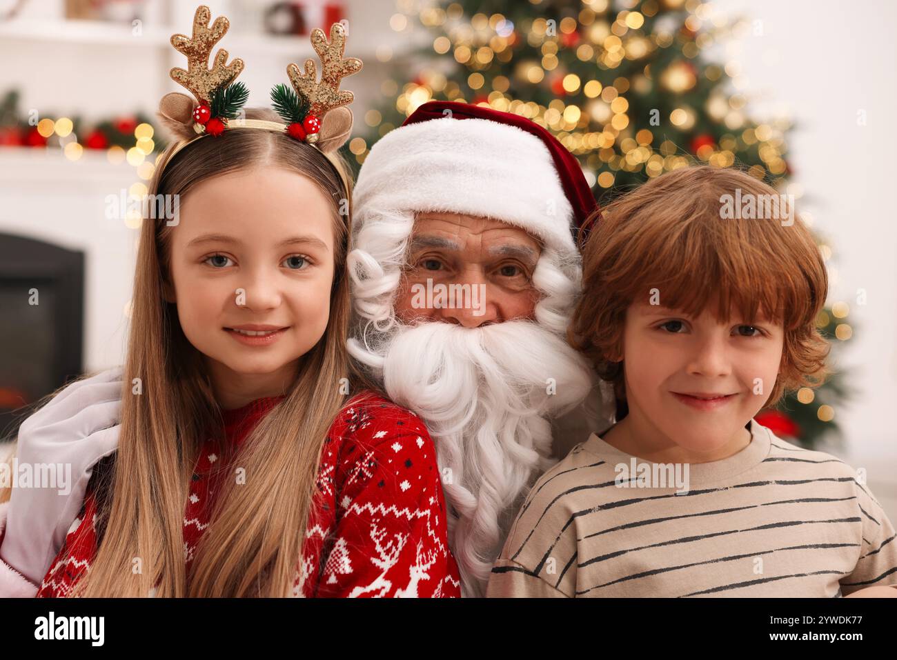Christmas celebration. Santa Claus and children at home Stock Photo - Alamy