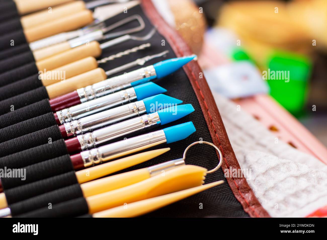 A collection of brushes is inside a case on the table Stock Photo - Alamy