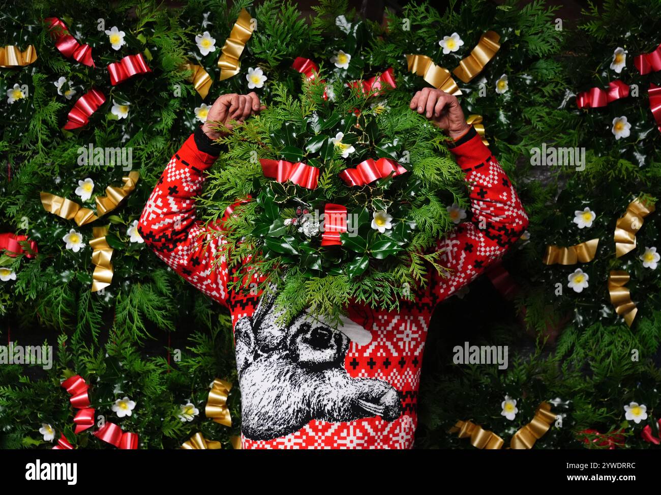 Stephen Roxburgh displays Christmas wreaths after making them at the ...