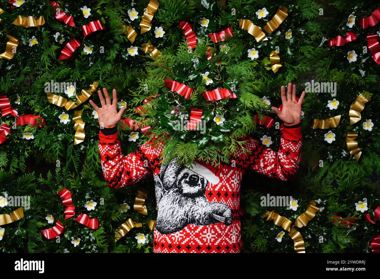 Stephen Roxburgh displays Christmas wreaths after making them at the ...