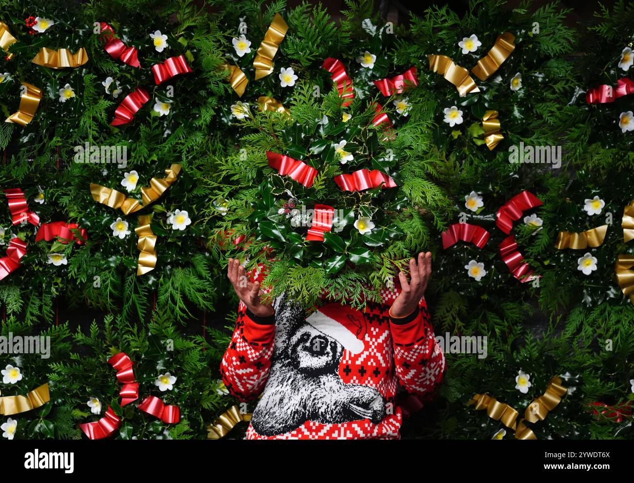 Stephen Roxburgh displays Christmas wreaths after making them at the ...