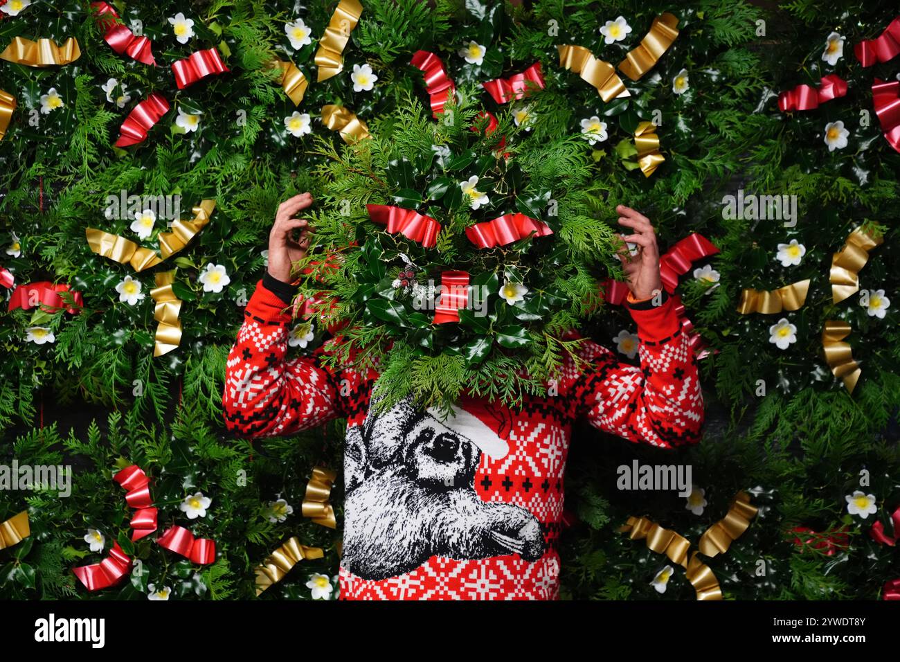 Stephen Roxburgh displays Christmas wreaths after making them at the ...