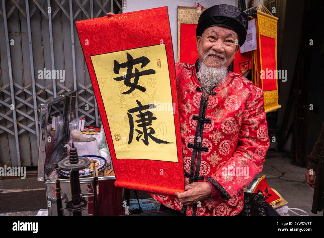 Vietnam, Hanoi, 2024-02-07, ancient master calligrapher presenting ...