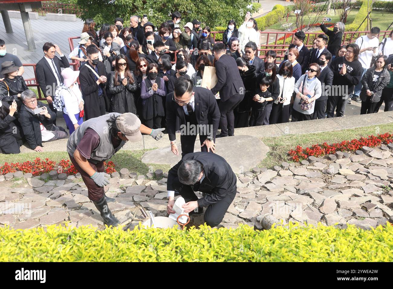 TAIPEI, CHINA - NOVEMBER 11, 2024 - Family members hold a cremation ...
