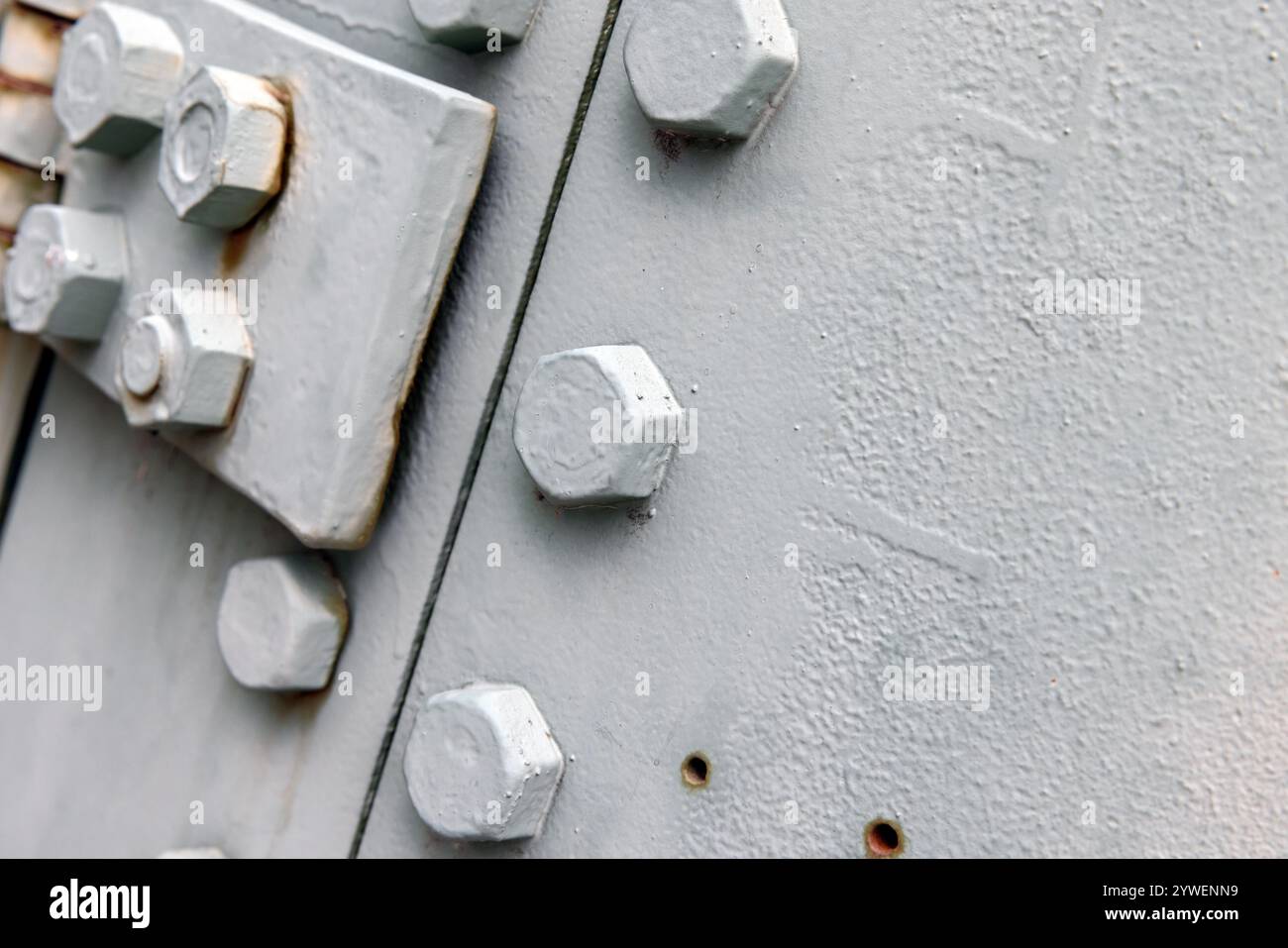 White steel wall details connected with bolts, close-up abstract ...