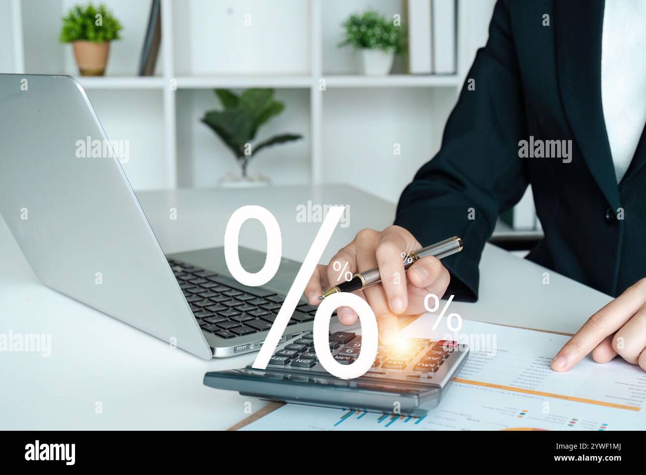 Calculating percentages and financial analysis in a modern office ...