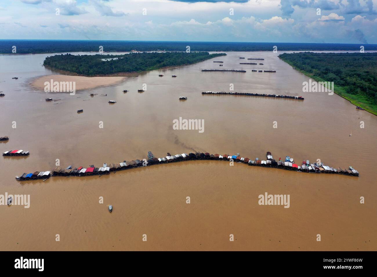 FILE - Dredging barges operated by illegal miners converge on the ...