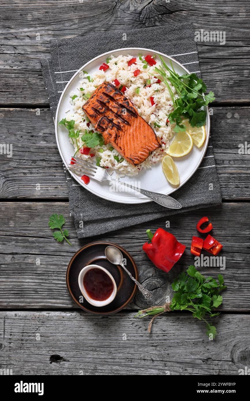 grilled red salmon fillet with jasmine rice, cilantro and lemon slices ...