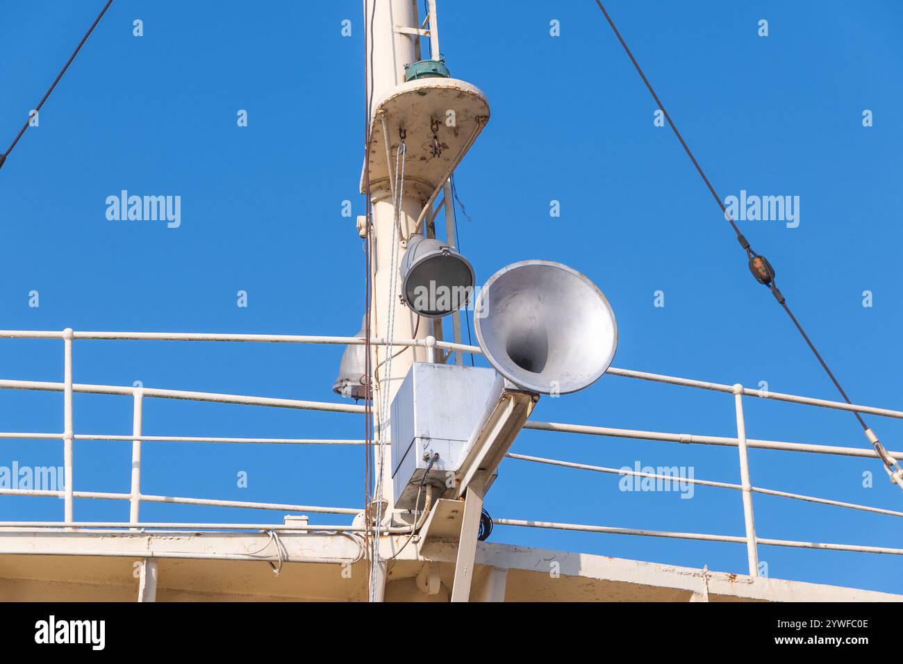 a ship's upper deck featuring metal structures such as a large ...