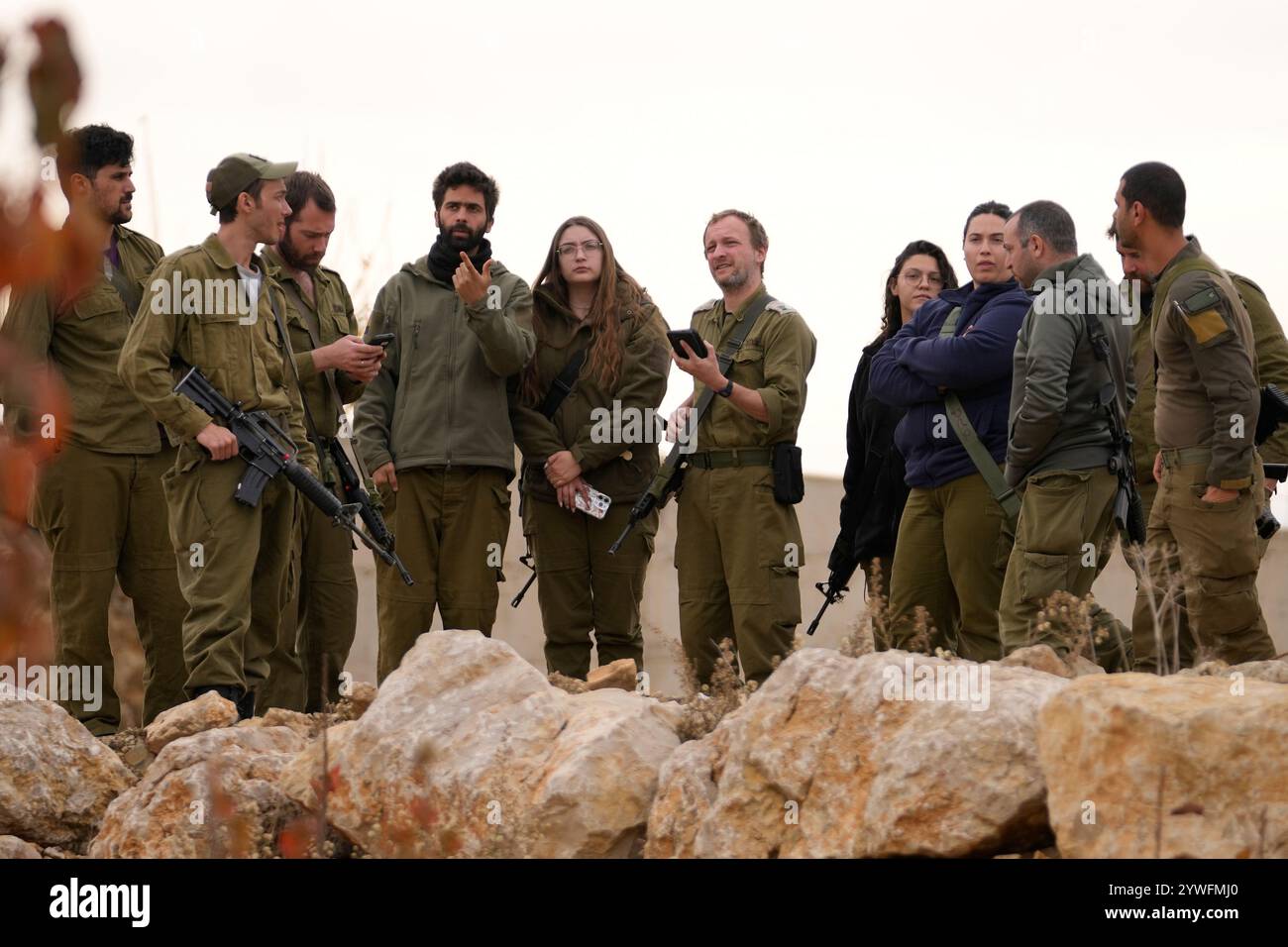 Israeli soldiers watch the mountain where the so-called Alpha Line that ...