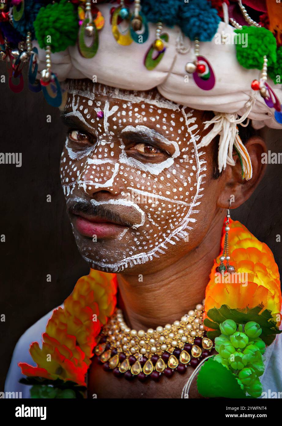 Tribal Rathva man with painted face in the annual tribal festival of ...