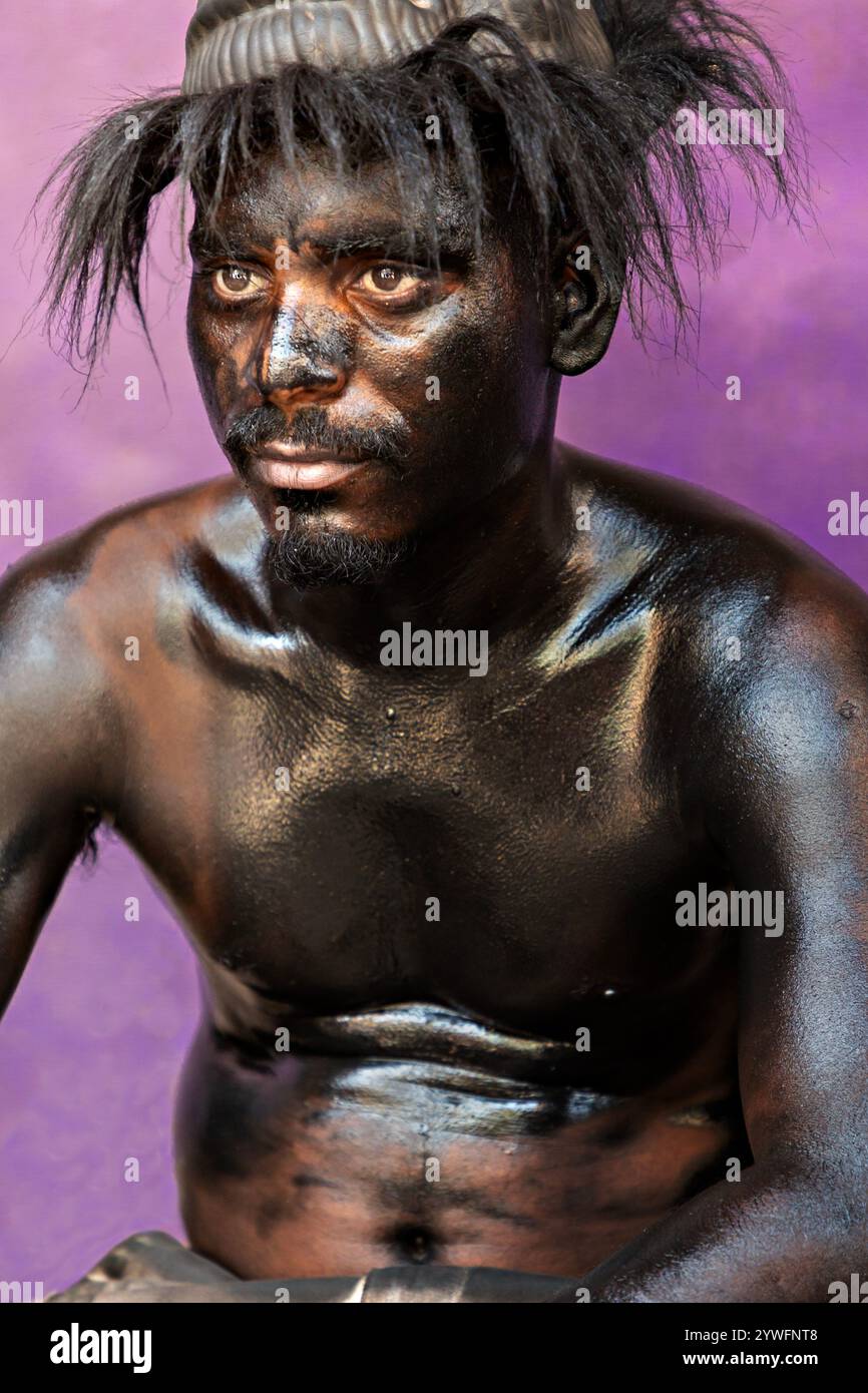 Tribal Rathva man with painted face and body in the annual tribal ...