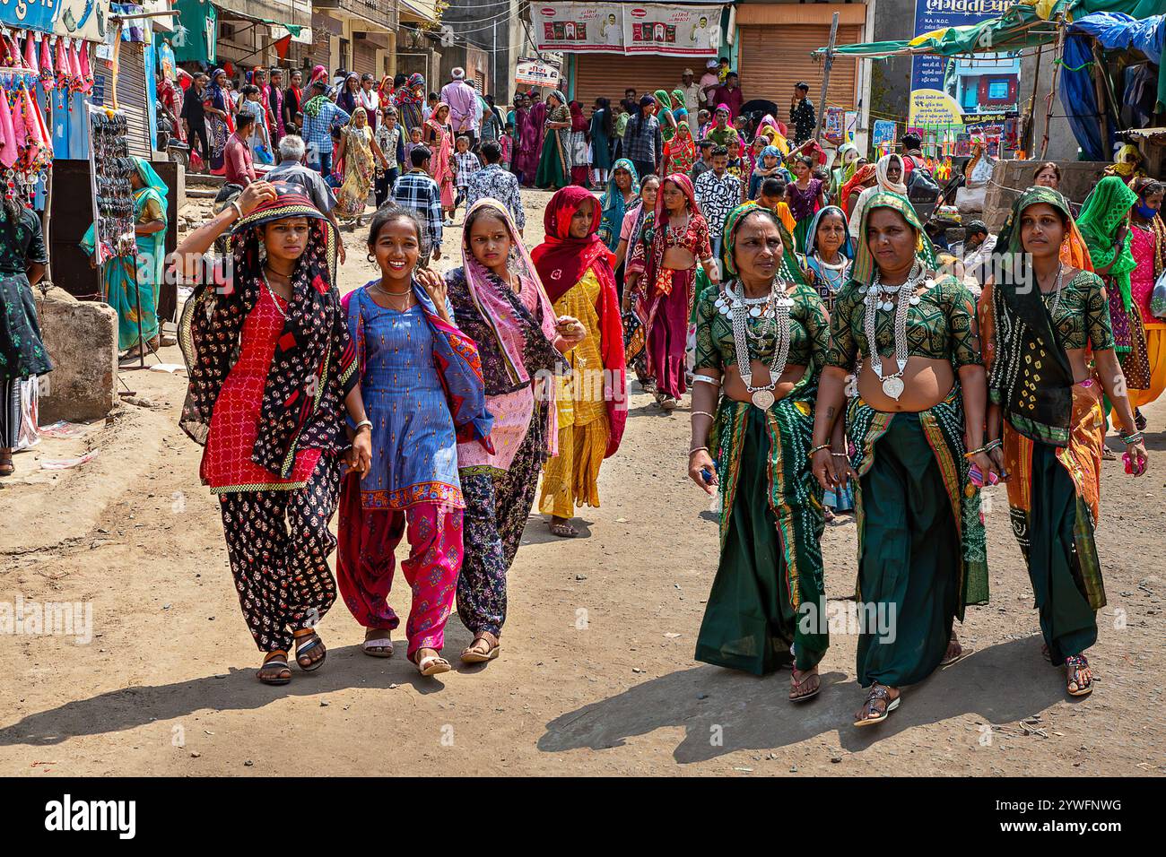 Local people in traditional colorful dresses at the Kawant Festival in ...