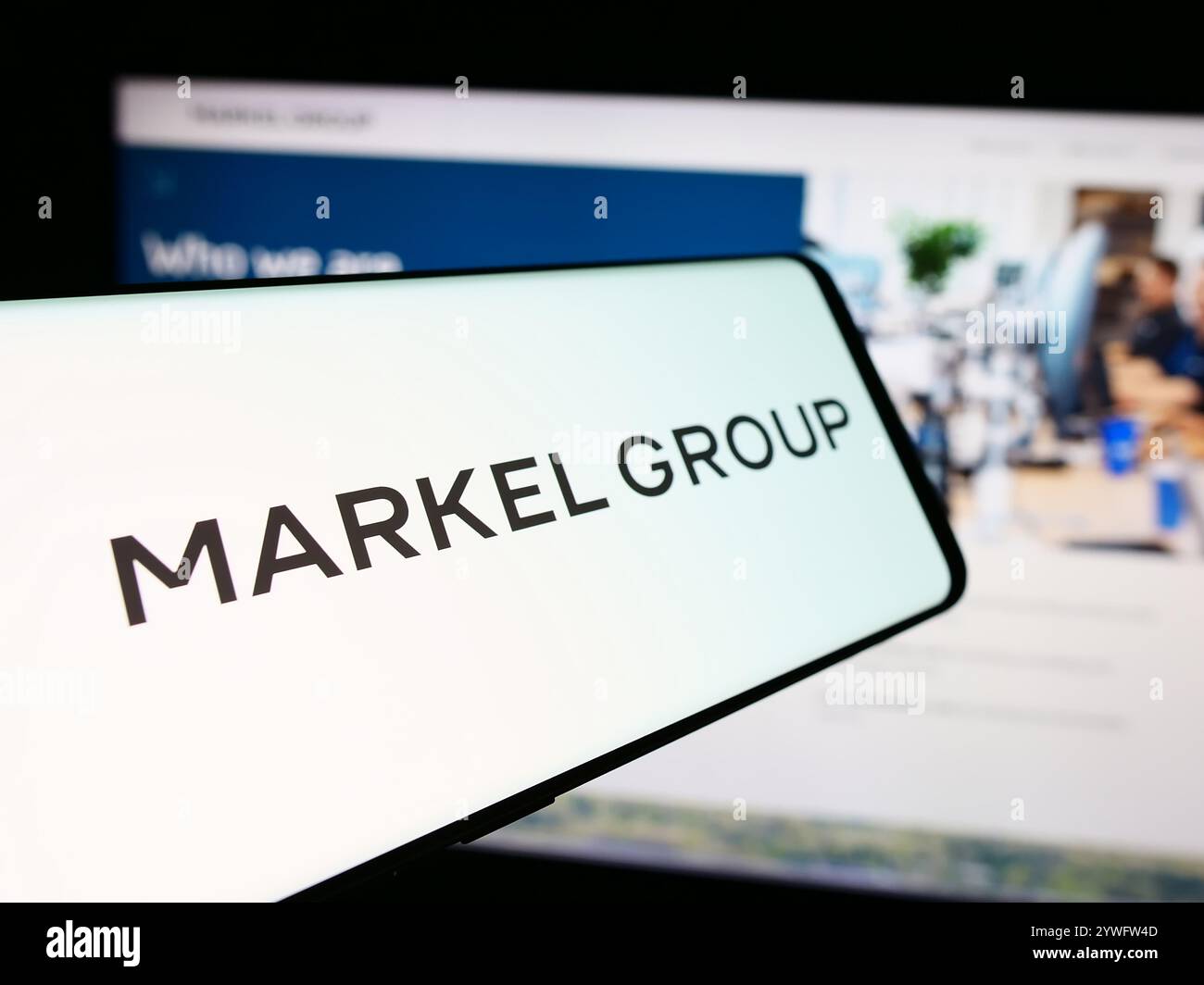 In this photo illustration, a mobile phone with the logo of American ...