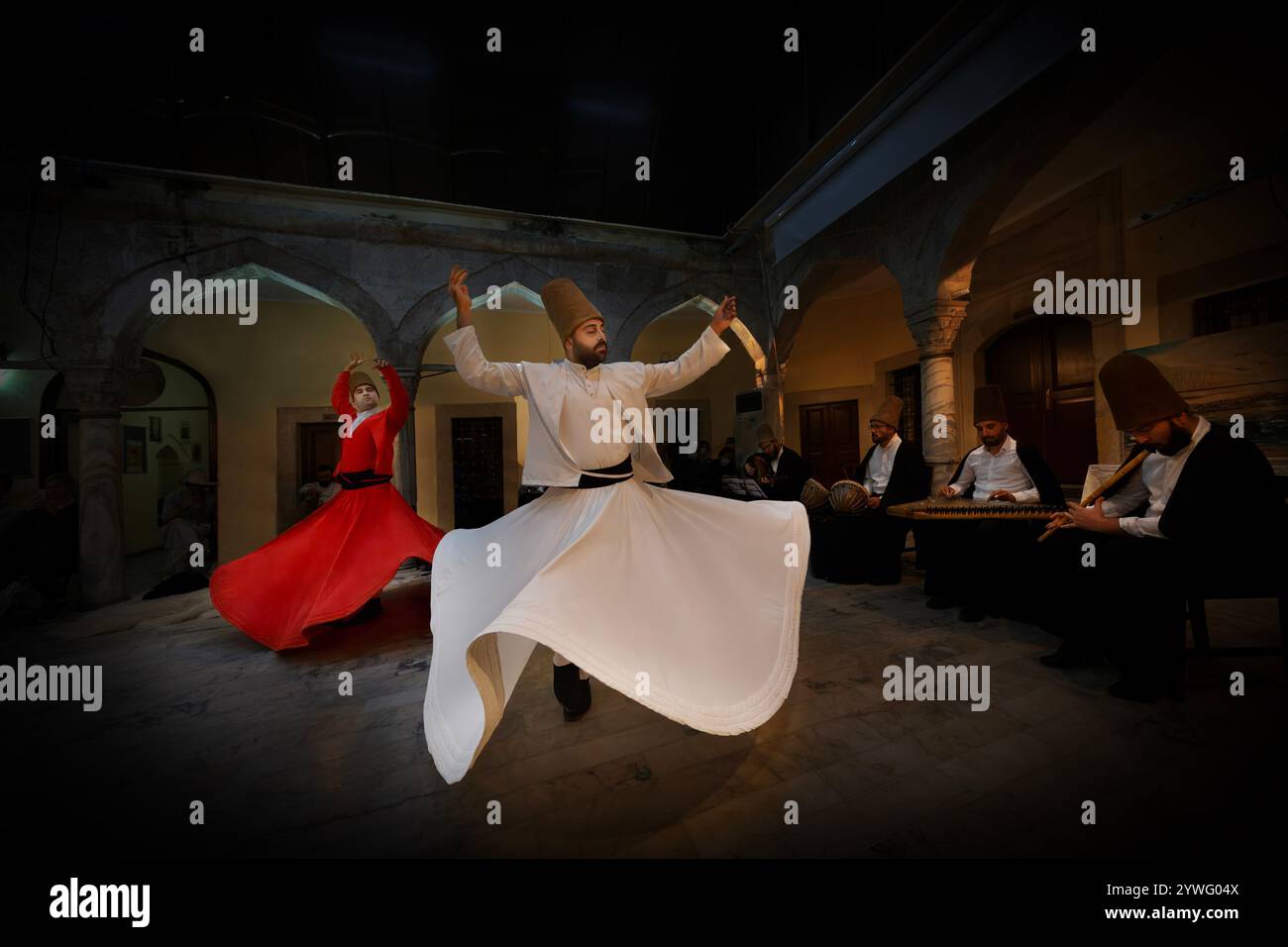 Whirling dervishes during Sufi whirling ritual performance known as ...