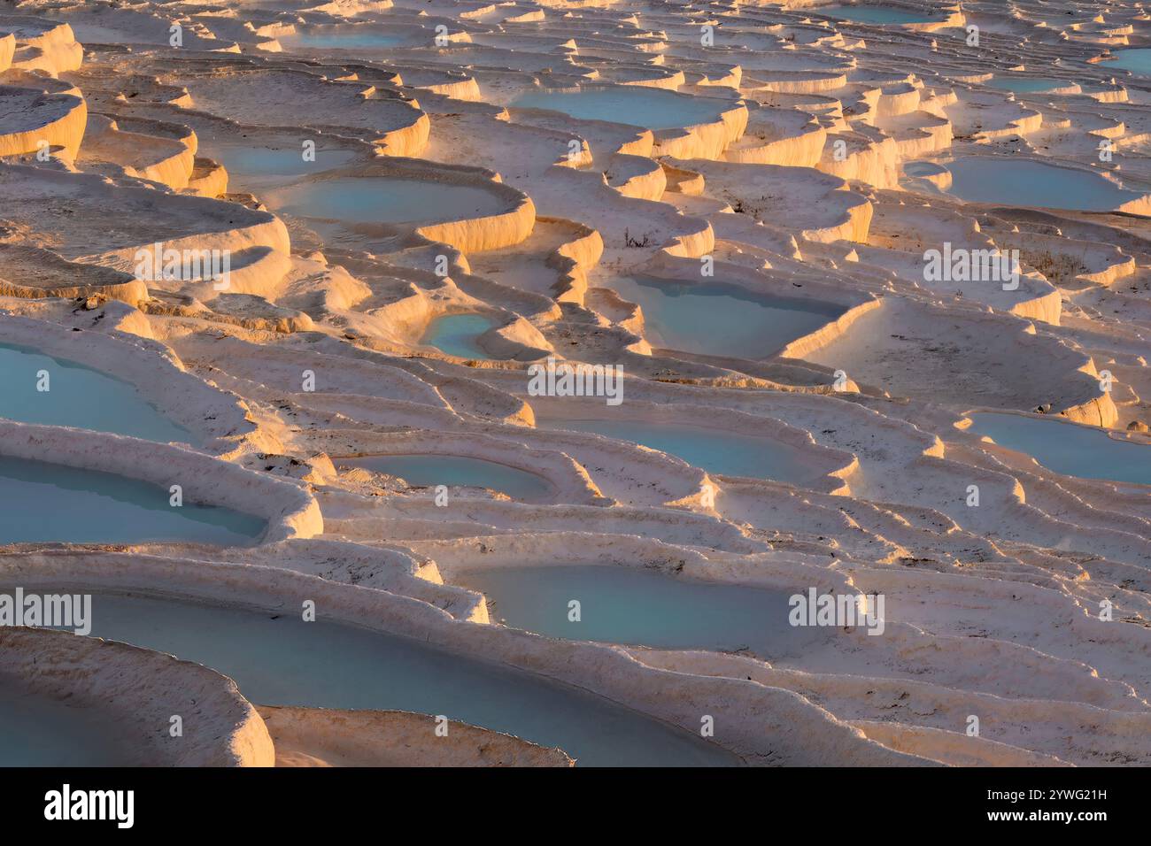 Natural travertine pools and terraces at the sunset in Pamukkale ...