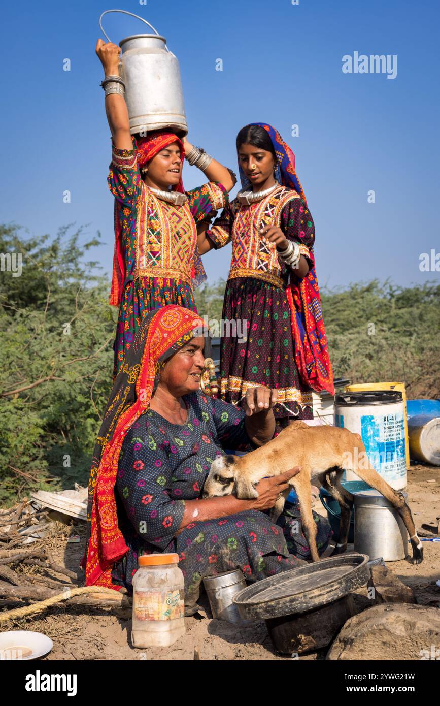 Two girls and their mother from a tribal community dressed in ...